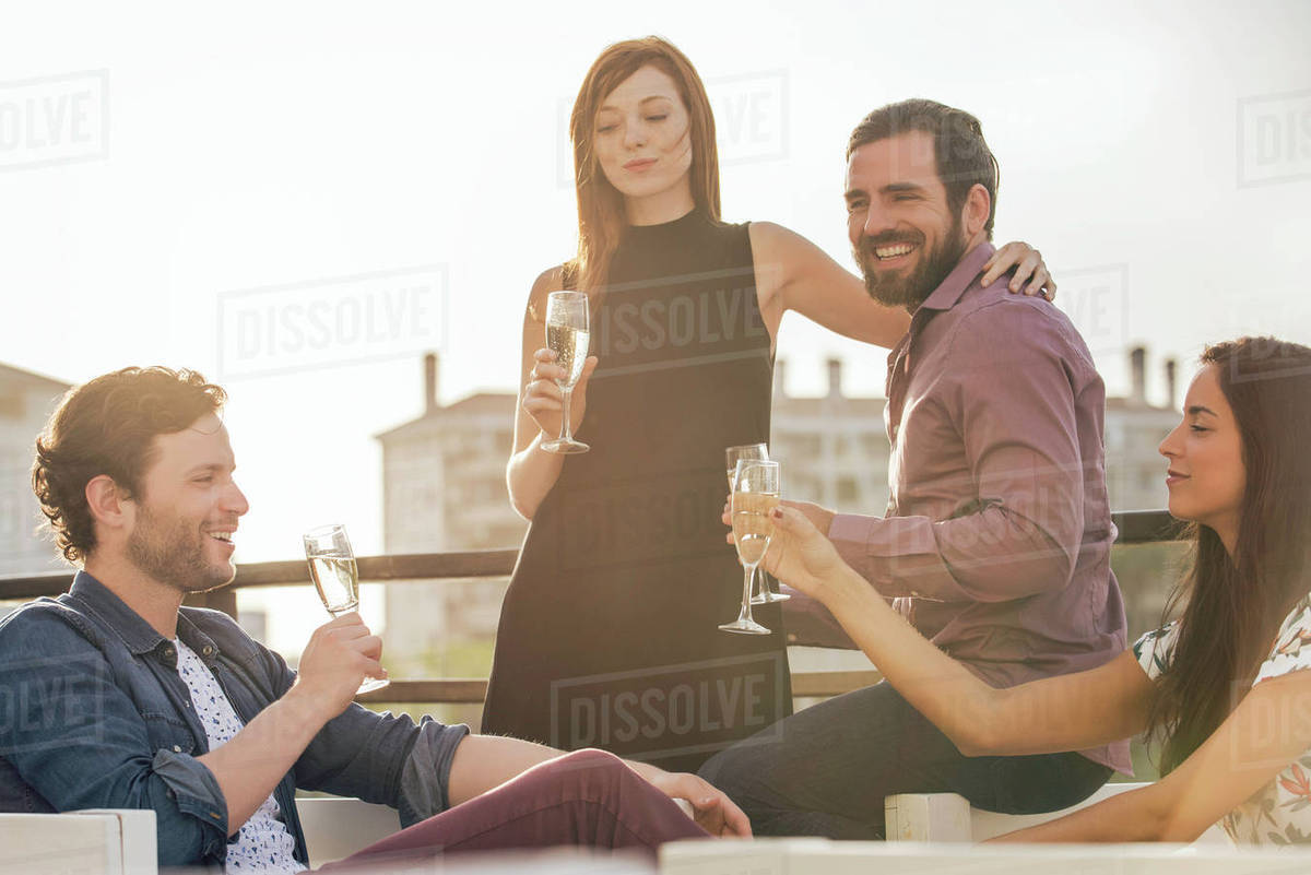 Friends drinking champagne together outdoors - Royalty-free Stock Photo ...