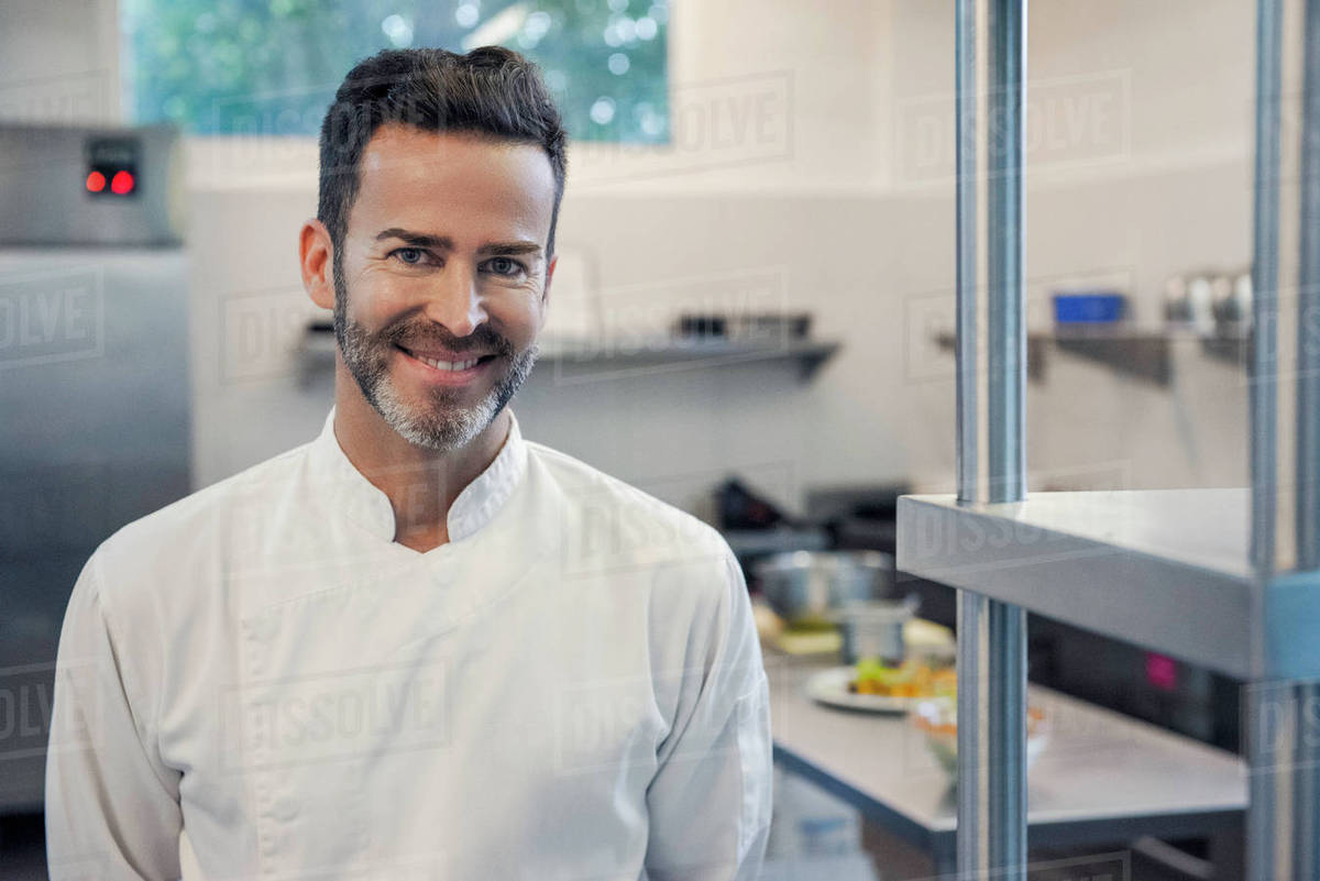 Chef in commercial kitchen, portrait - Stock Photo - Dissolve