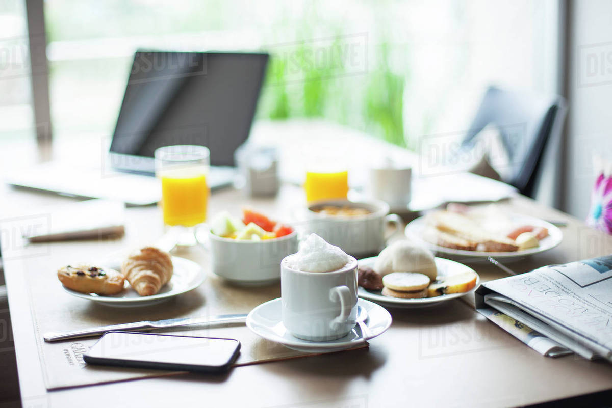 Coffee and breakfast on cafe table - Royalty-free Stock Photo | Dissolve