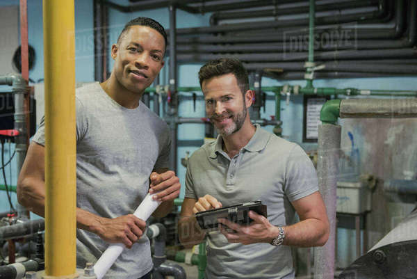 Men working in industrial setting, portrait - Royalty-free Stock Photo ...