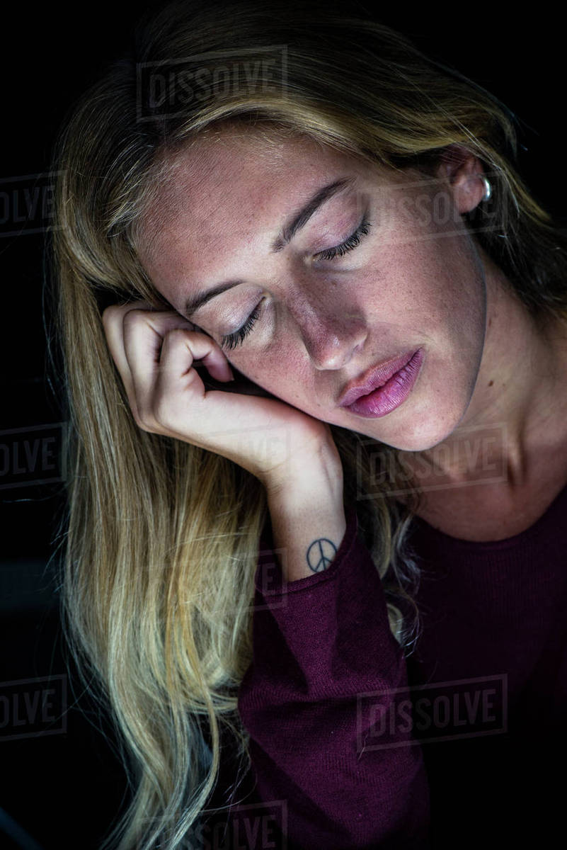 Young woman falling asleep, portrait - Royalty-free Stock Photo | Dissolve