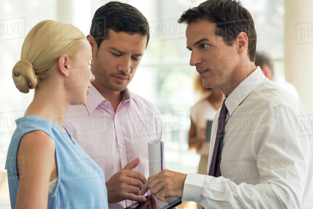 Businessman explaining position to colleagues - Royalty-free Stock ...