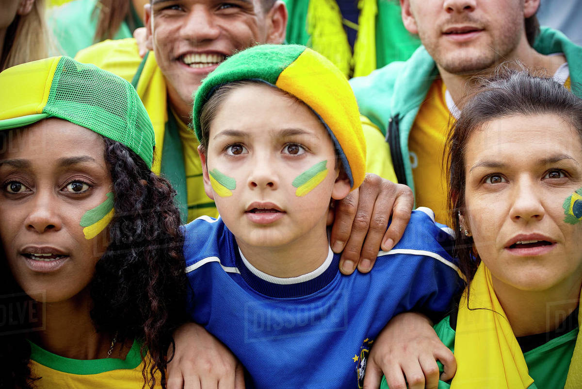 Brazilian football supporters watching match attentively - Royalty-free ...
