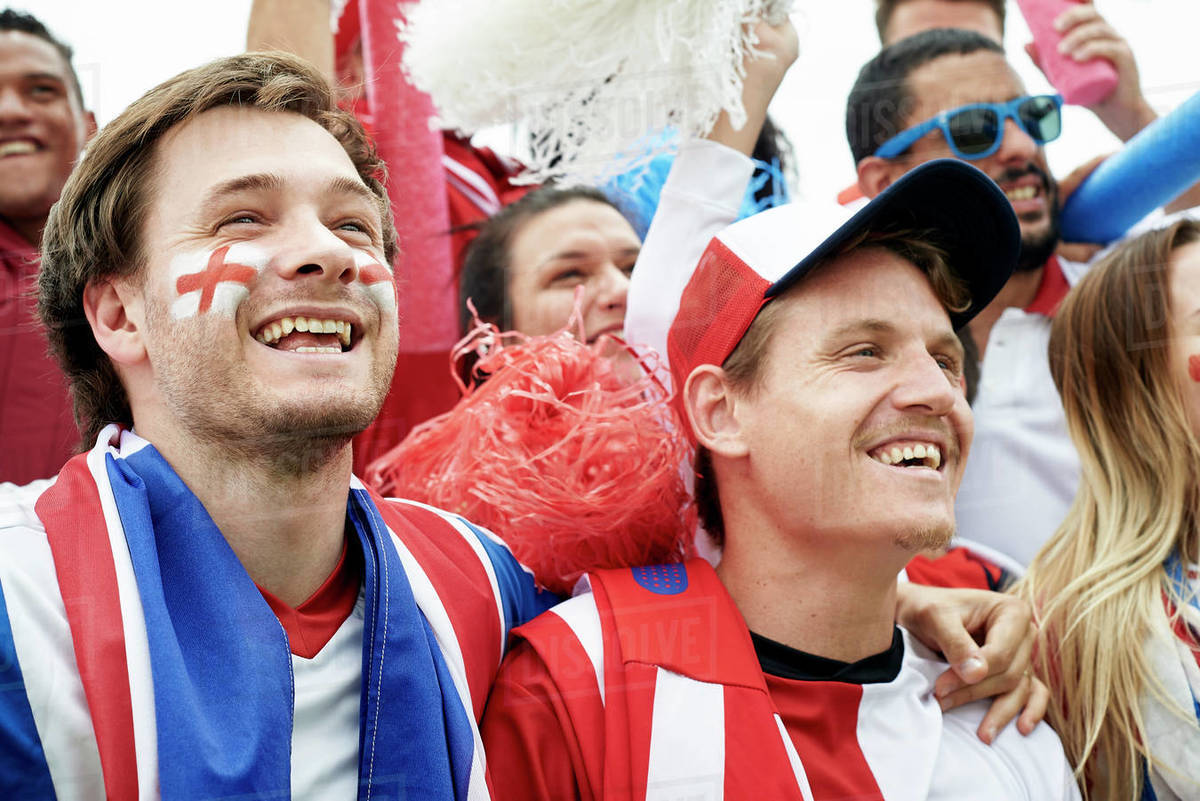 British football fans watching football match - Stock Photo - Dissolve