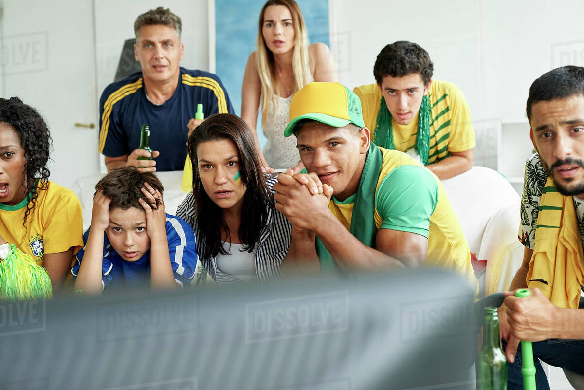 Brazilian soccer fans watching televised match together - Stock Photo ...