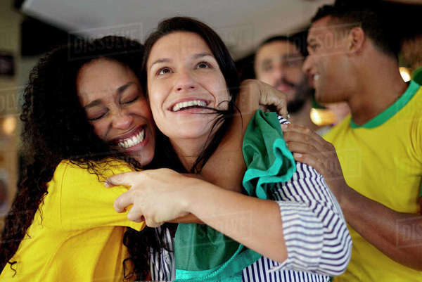 Sports enthusiasts celebrating victory in bar - Royalty-free Stock ...