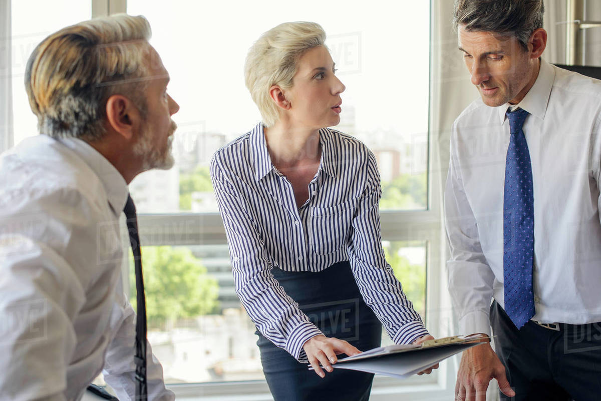 Colleagues working together in office - Stock Photo - Dissolve