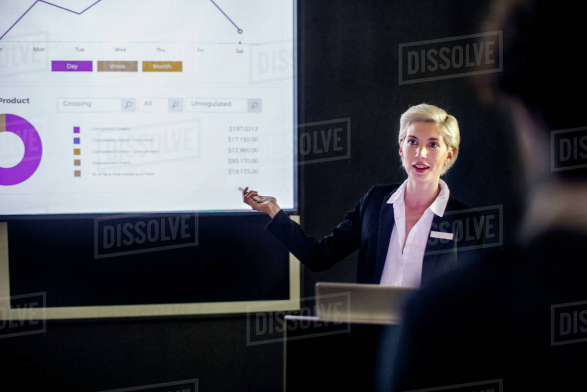 Woman giving presentation - Royalty-free Stock Photo | Dissolve