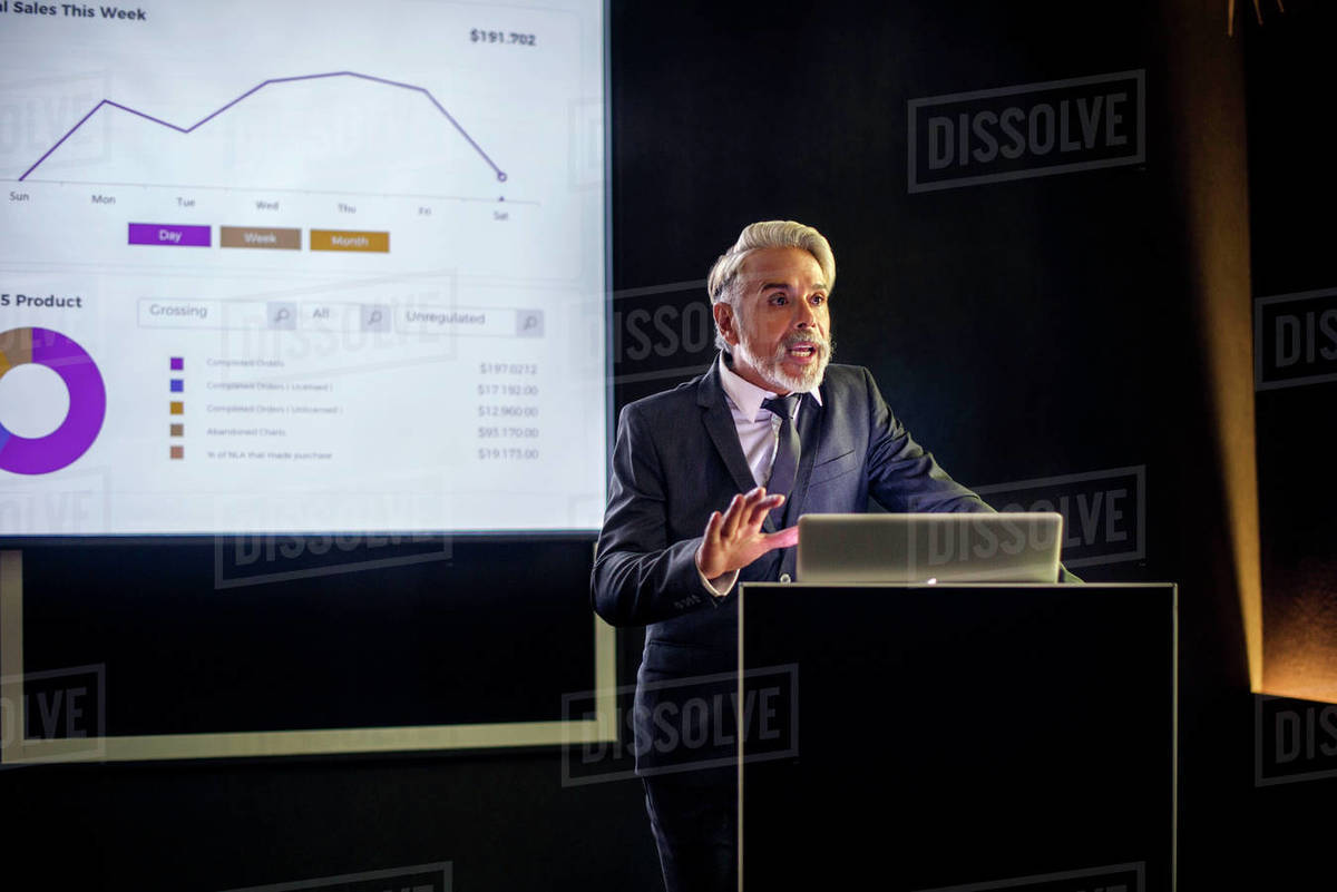 Man giving presentation - Stock Photo - Dissolve