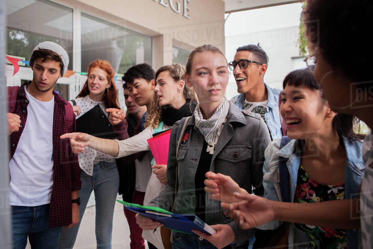 College students looking at information posted on campus - Stock Photo ...
