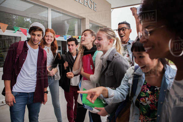 College students gathered together on campus, looking excited - Royalty ...