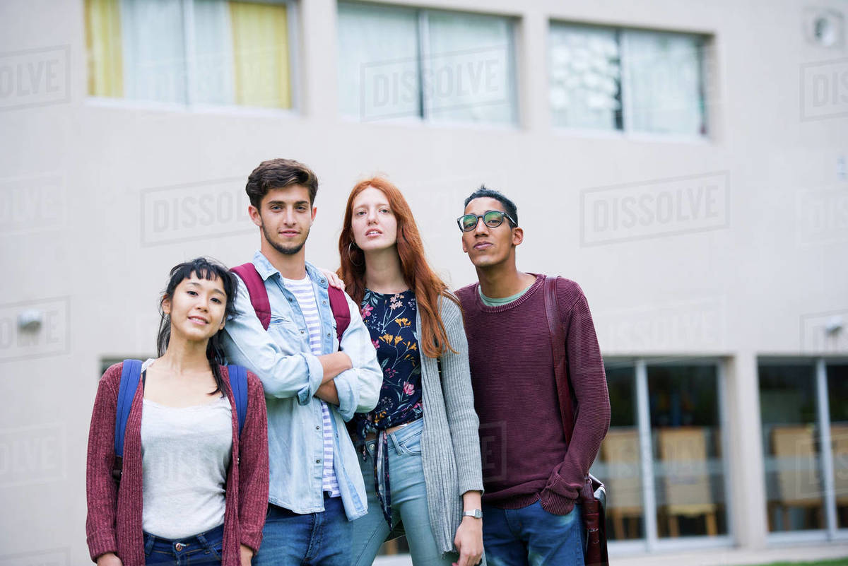 Students standing together outdoors, portrait - Stock Photo - Dissolve