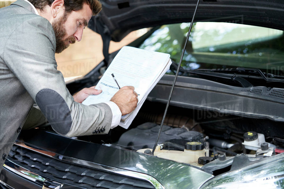 Man writing on documents - Royalty-free Stock Photo | Dissolve
