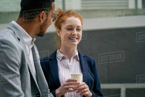 Couple talking outdoors - Stock Photo - Dissolve