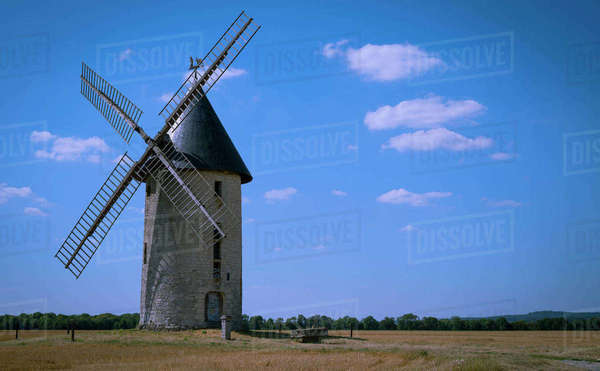 Windmill on field - Royalty-free Stock Photo | Dissolve