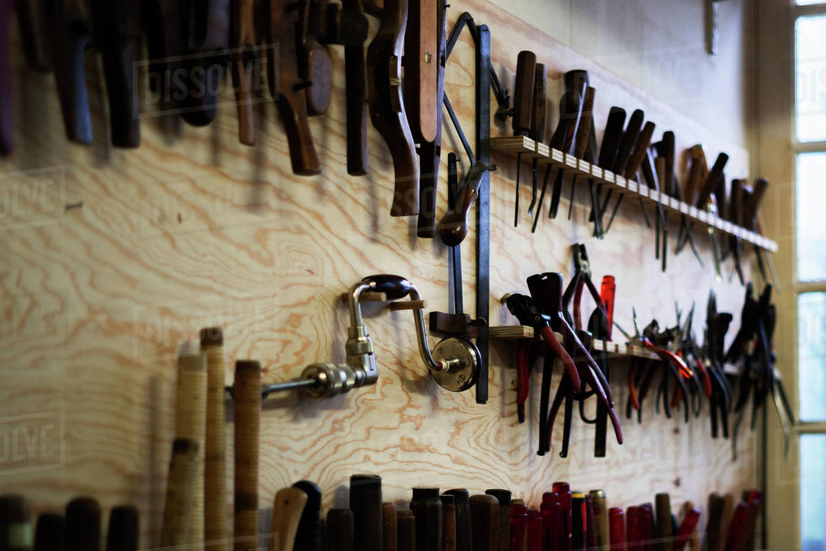 Hand tools hanging on pegboard - Royalty-free Stock Photo | Dissolve