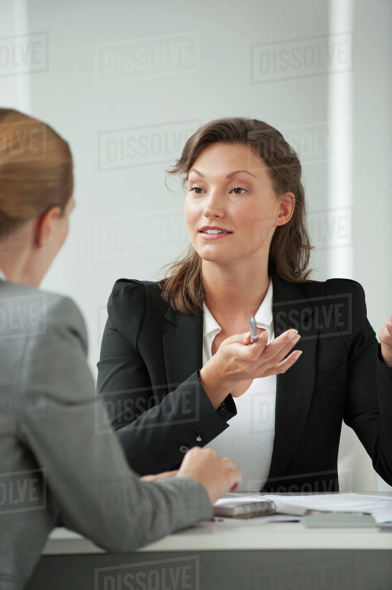 Businesswoman advising client - Royalty-free Stock Photo | Dissolve