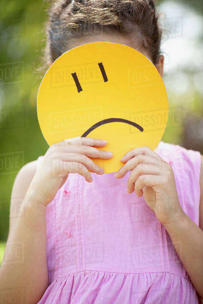 Girl with sad face mask - Stock Photo - Dissolve