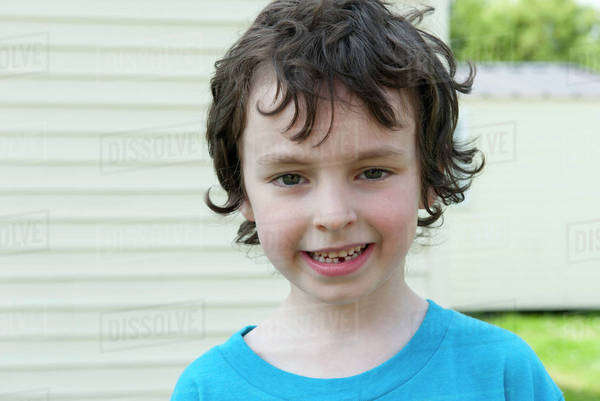 Boy smiling, portrait - Royalty-free Stock Photo | Dissolve