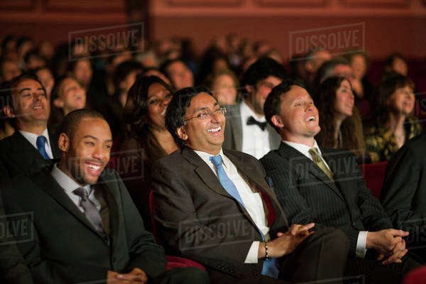 Laughing theater audience - Stock Photo - Dissolve
