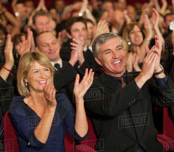 Enthusiastic theater audience clapping - Royalty-free Stock Photo ...