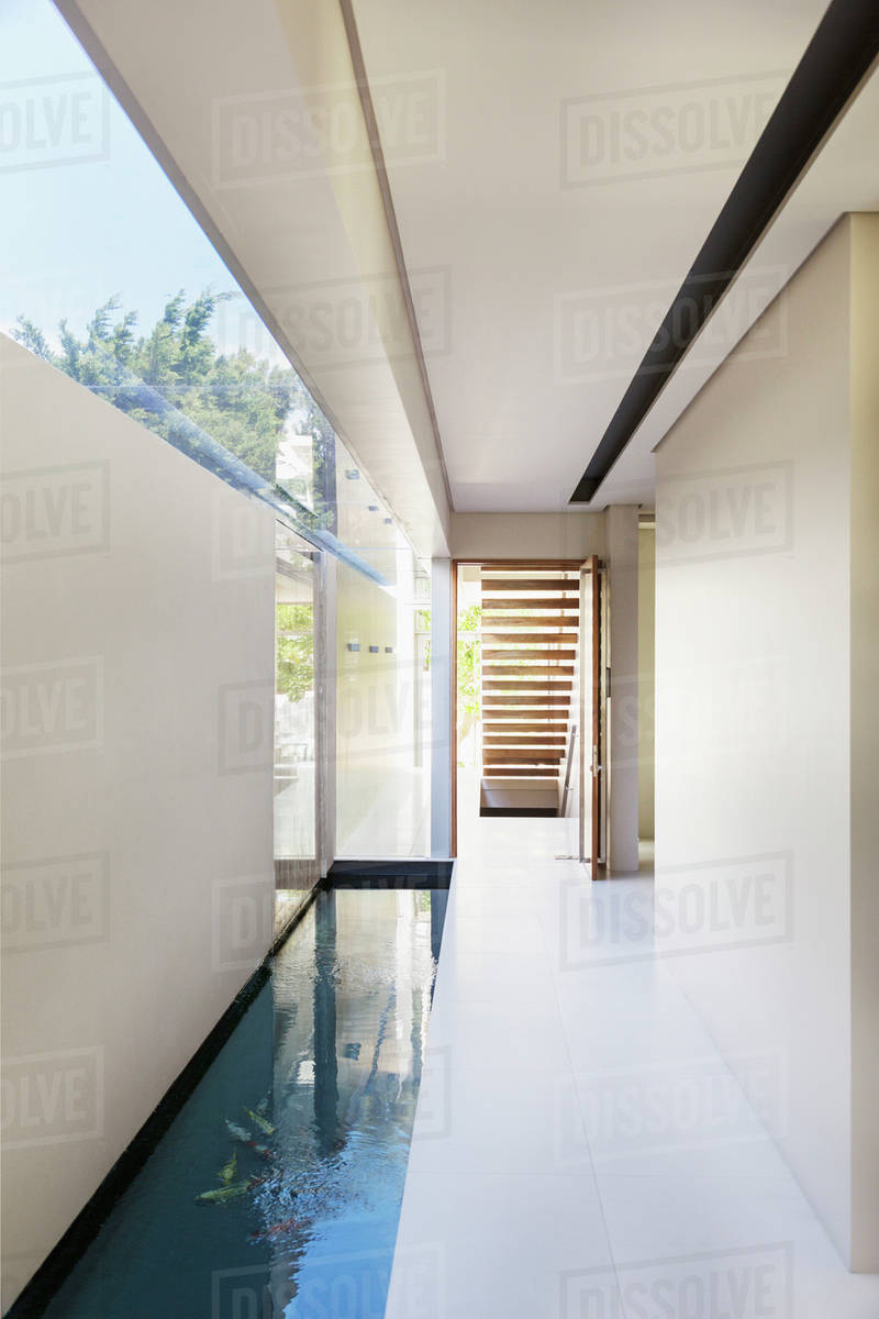 Pool and corridor of modern house - Stock Photo - Dissolve