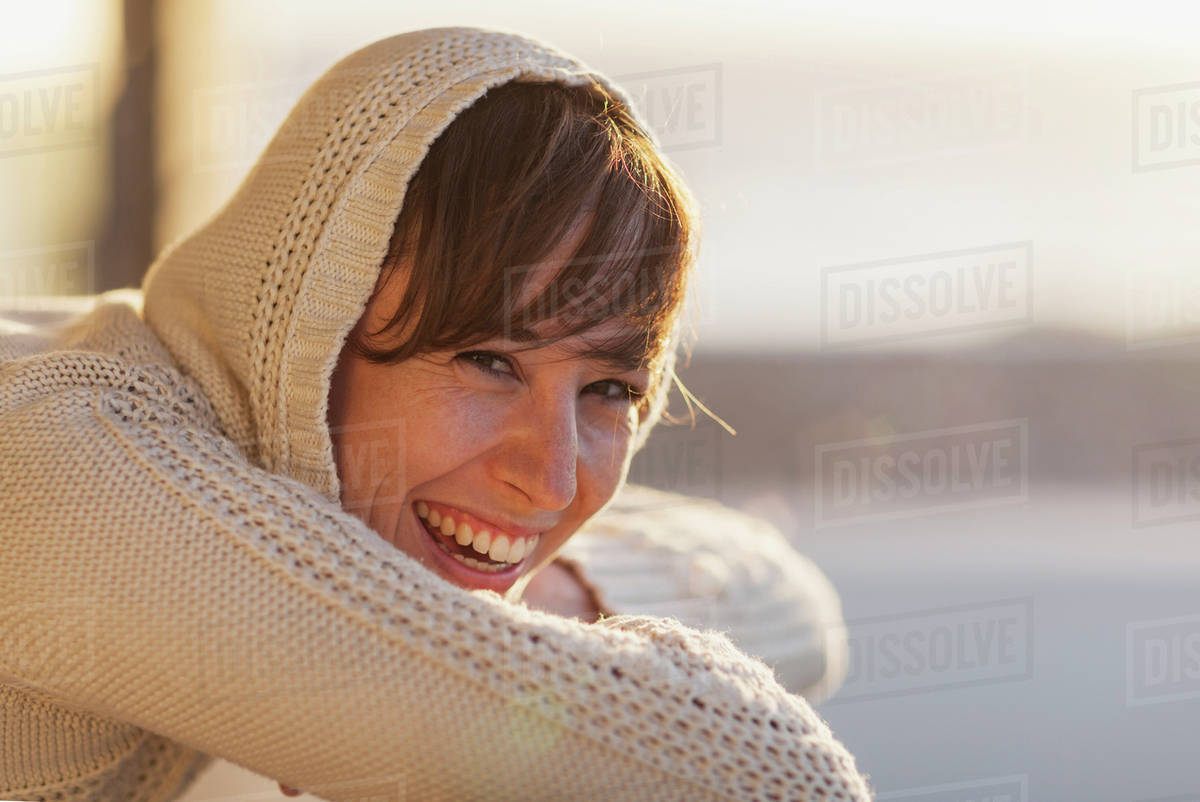 Woman laughing outdoors - Stock Photo - Dissolve
