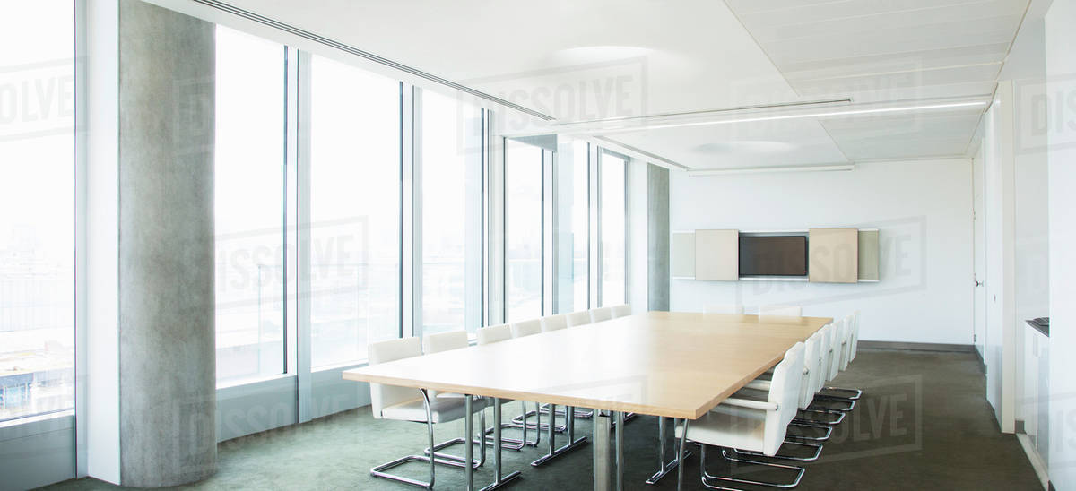 Empty meeting table in office - Stock Photo - Dissolve
