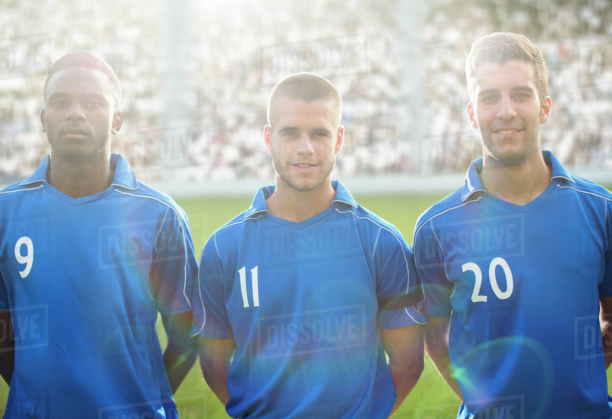 Soccer players smiling on field - Royalty-free Stock Photo | Dissolve