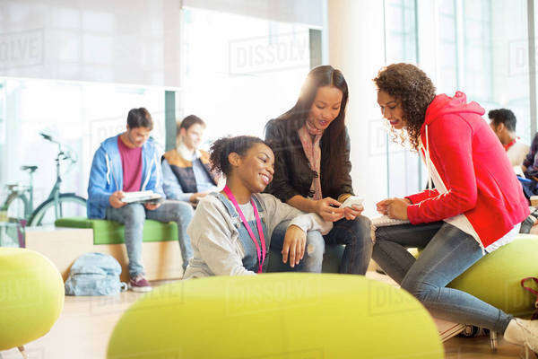 University students talking in lounge - Stock Photo - Dissolve