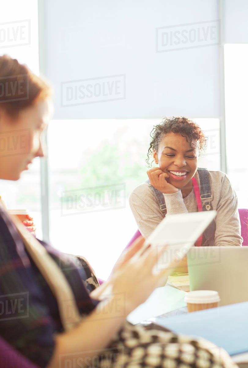 University students relaxing in lounge - Stock Photo - Dissolve