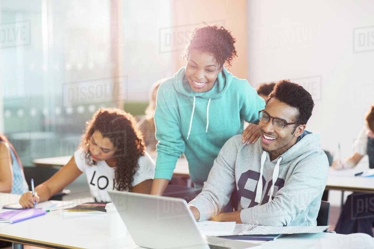 University students working in classroom - Stock Photo - Dissolve