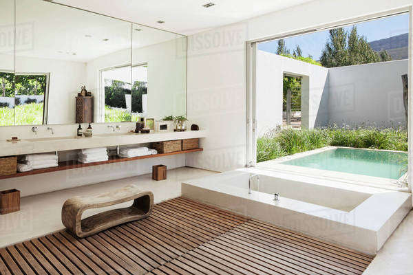 Modern bathroom overlooking luxury soaking pool - Royalty-free Stock ...