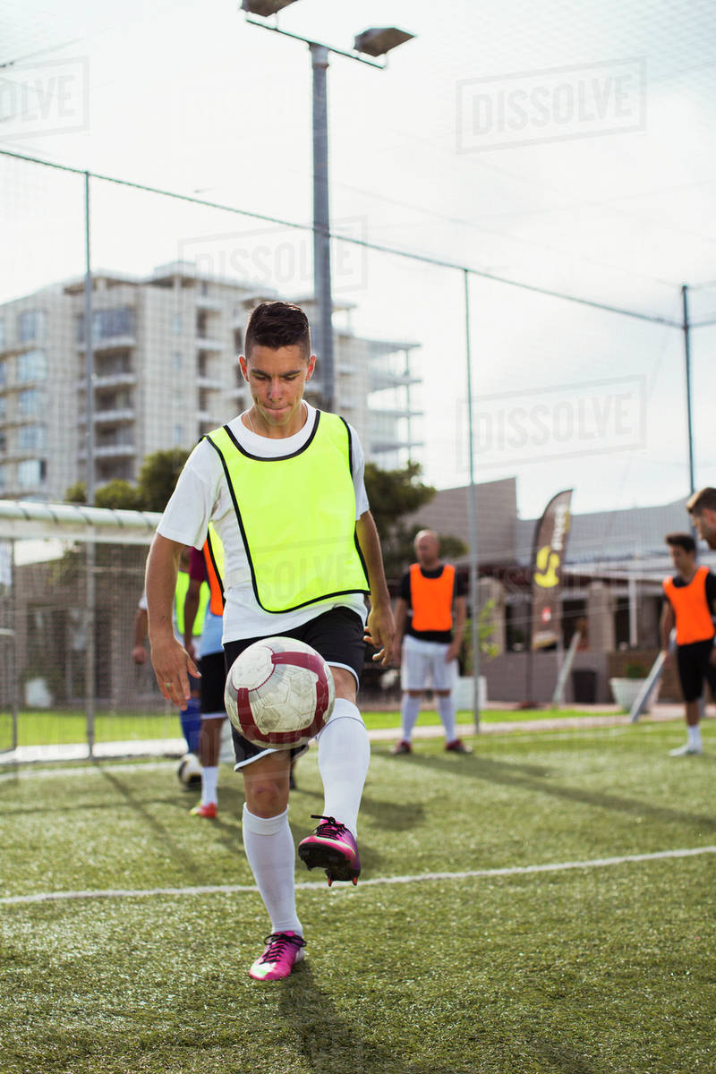 Soccer player training on field - Royalty-free Stock Photo | Dissolve