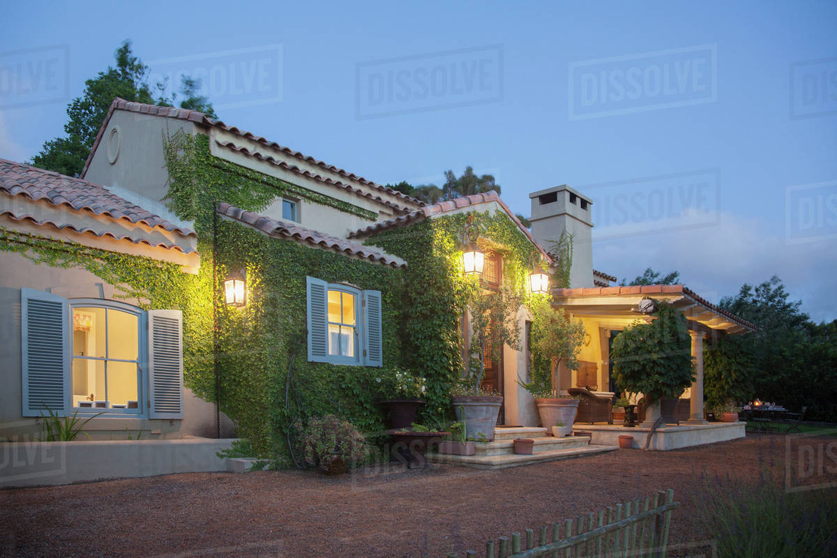 Luxury villa illuminated at night - Stock Photo - Dissolve