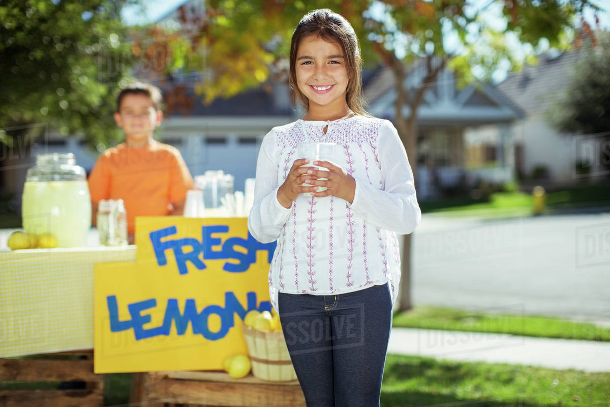 Portrait of smiling girl at lemonade stand - Royalty-free Stock Photo ...