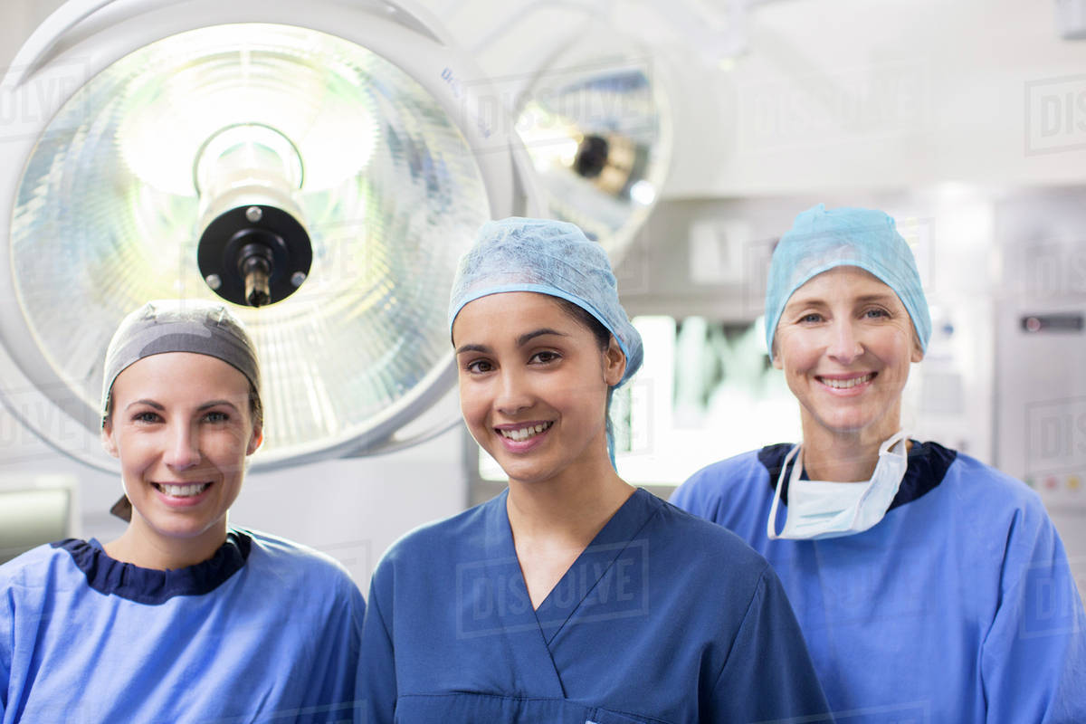 Portrait of three female surgeons in operating theater - Royalty-free ...