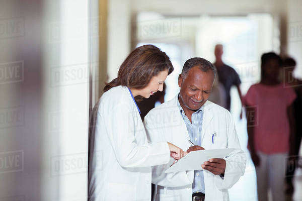 Doctors reading medical chart in hospital - Royalty-free Stock Photo ...