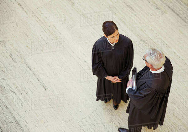 Judges talking in courthouse - Royalty-free Stock Photo | Dissolve