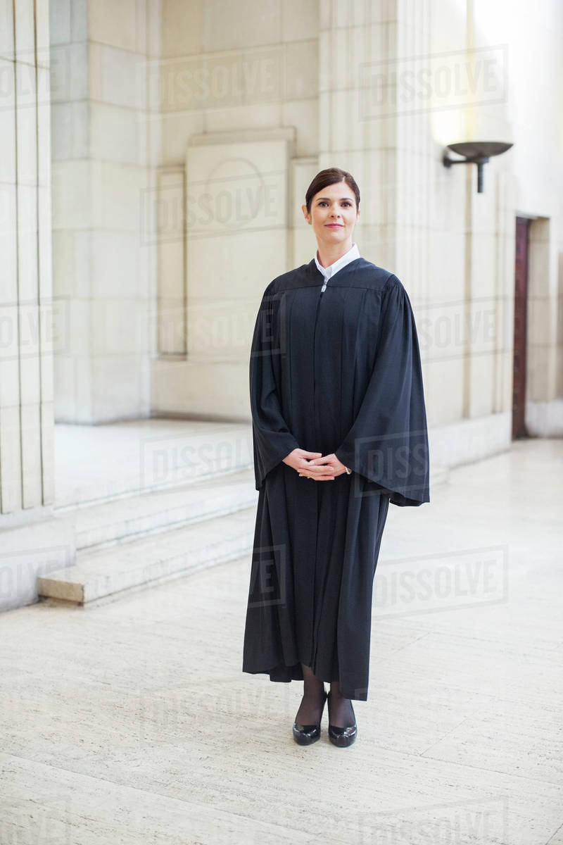 Judge standing in courthouse - Royalty-free Stock Photo | Dissolve