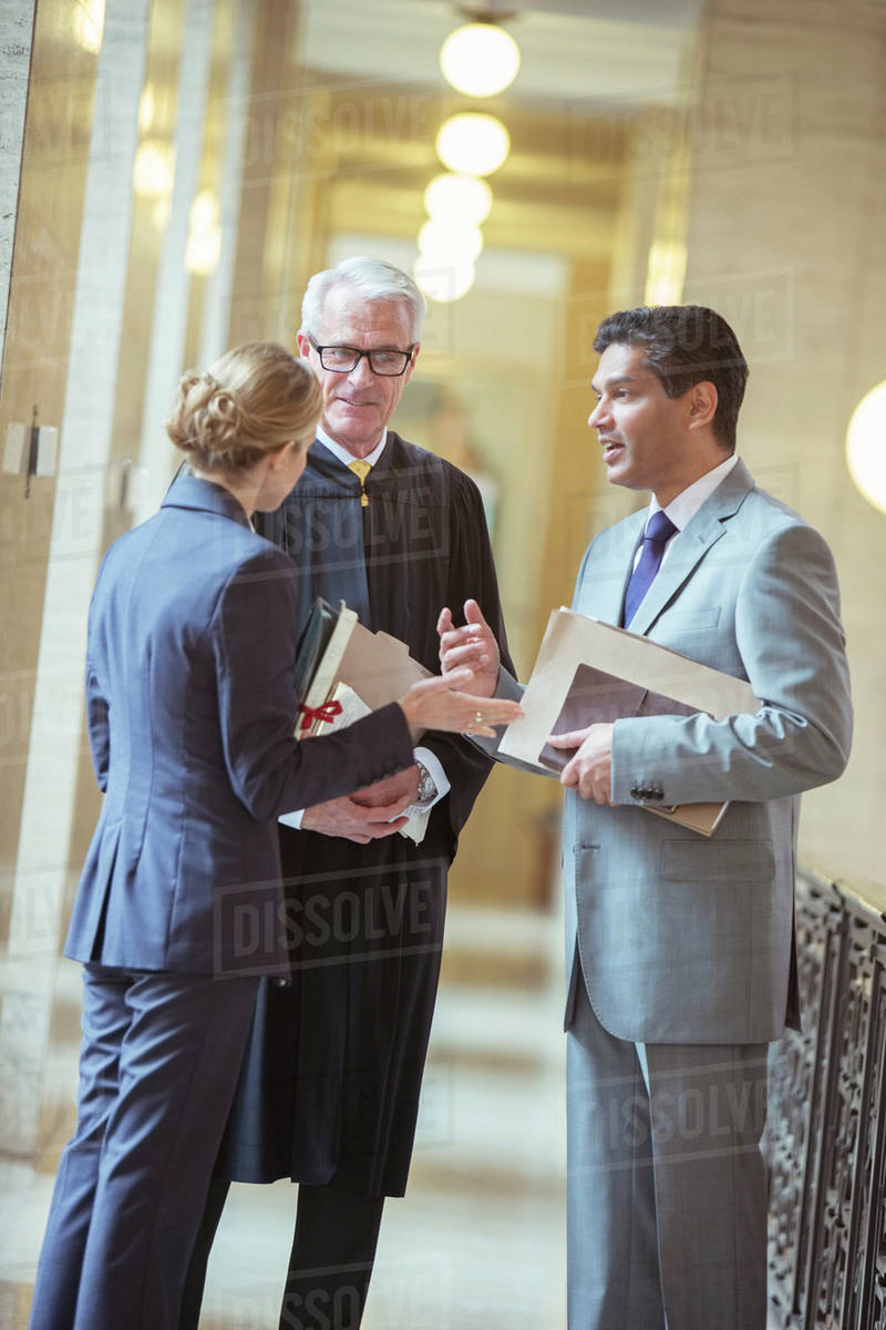 Judge and lawyers talking in courthouse - Royalty-free Stock Photo ...