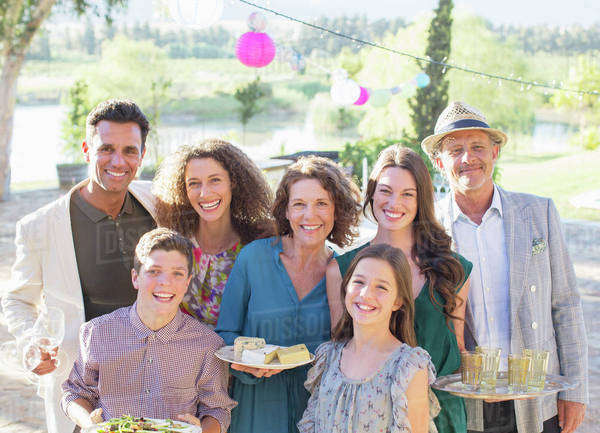 Family smiling together outdoors - Royalty-free Stock Photo | Dissolve