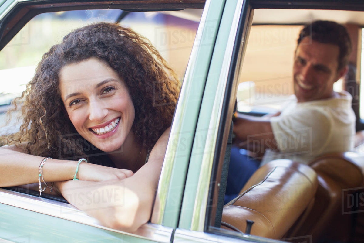 Woman relaxing on car door during car ride - Royalty-free Stock Photo ...