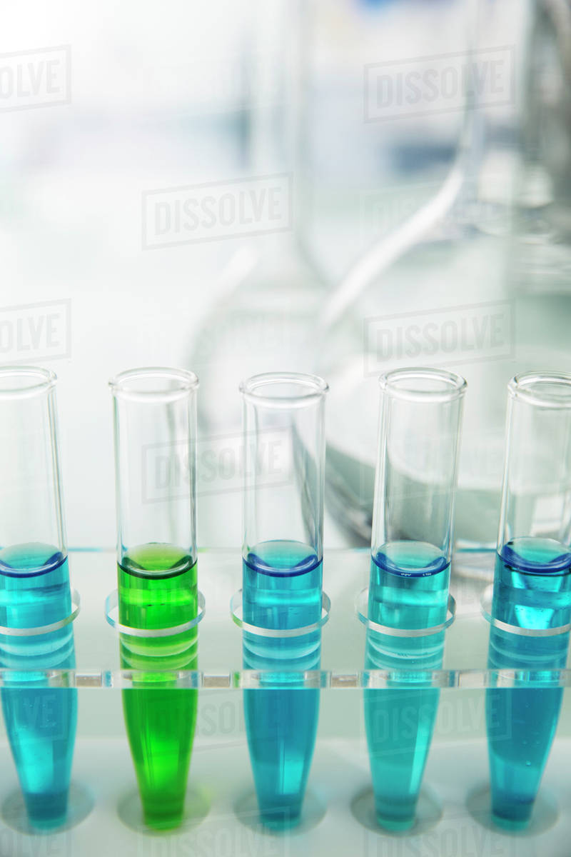 Rack of test tubes with solution on counter in lab - Royalty-free Stock ...