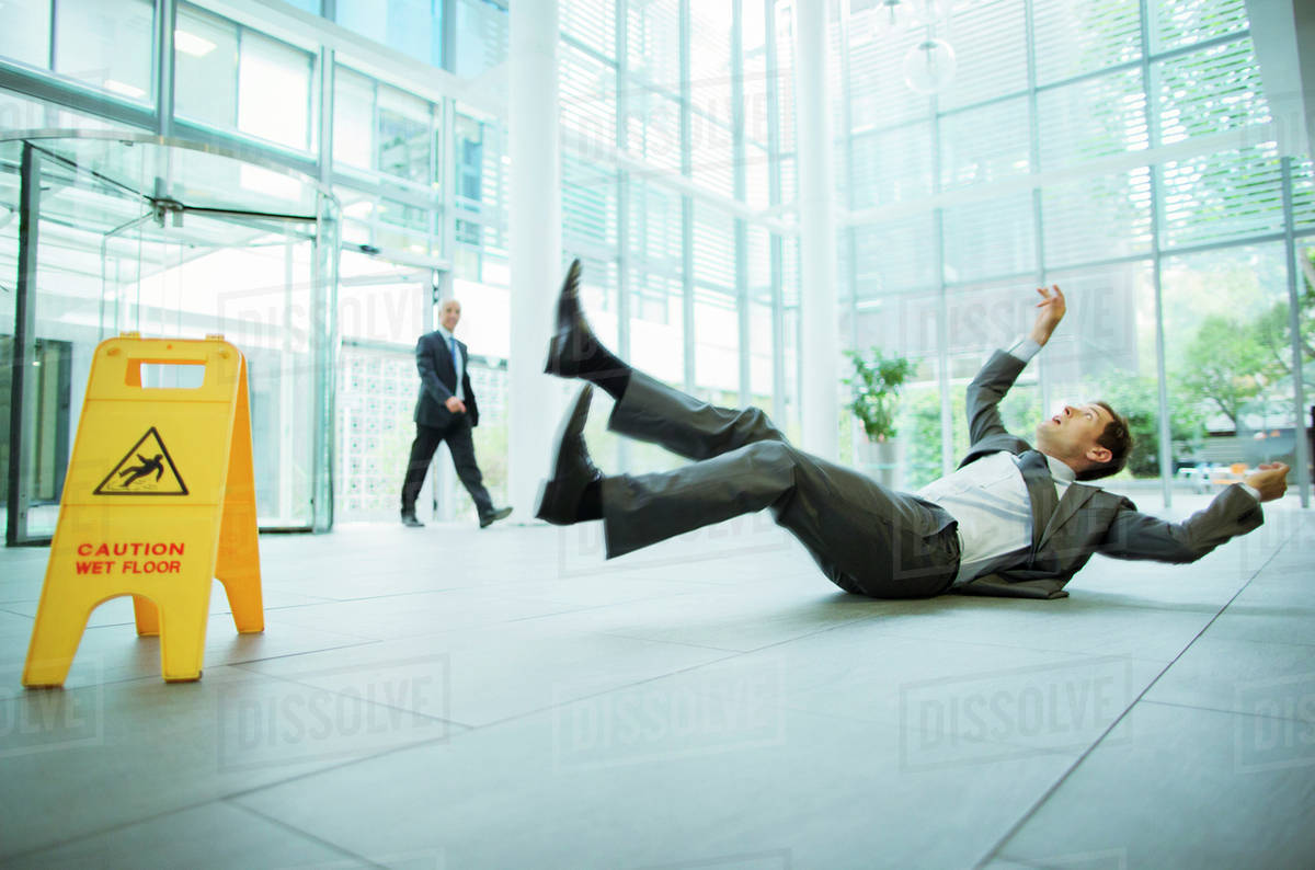 Businessman slipping on floor of office building - Royalty-free Stock ...