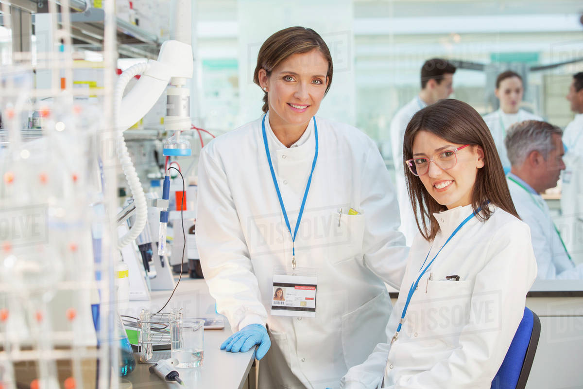 Scientists smiling in laboratory - Royalty-free Stock Photo | Dissolve