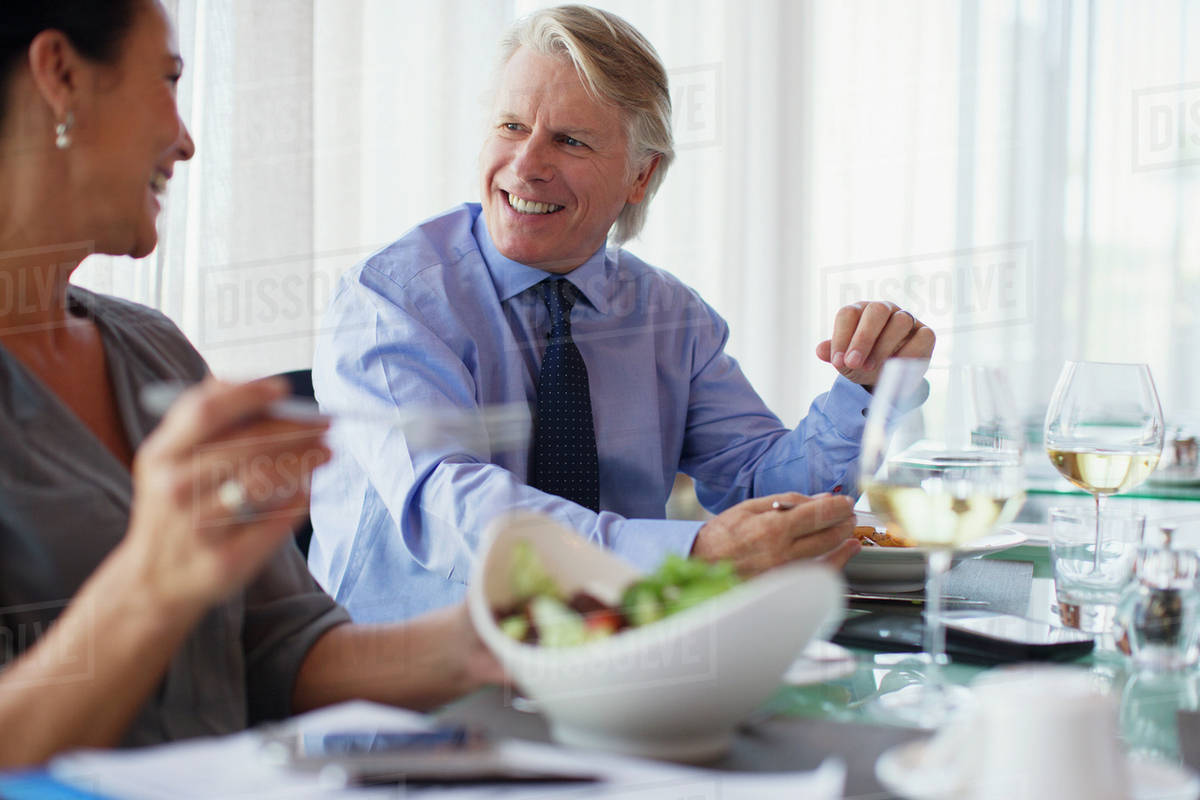 Smiling business people having lunch in restaurant - Royalty-free Stock ...