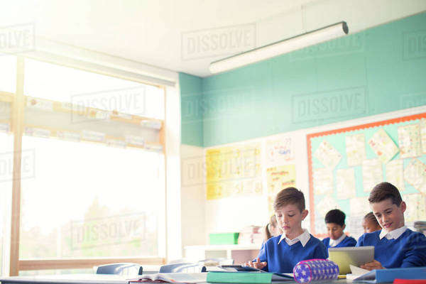 Elementary school children in classroom during lesson - Royalty-free ...