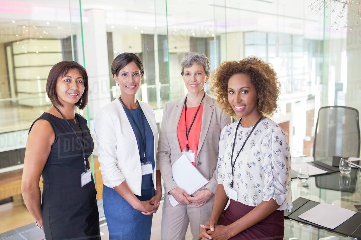 Portrait of four women standing in conference room - Royalty-free Stock ...