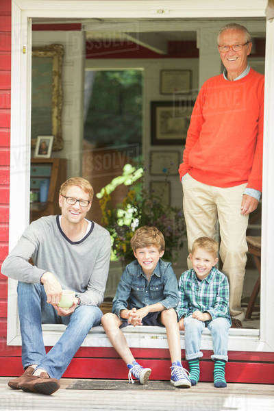 Brothers smiling with father and grandfather - Royalty-free Stock Photo ...